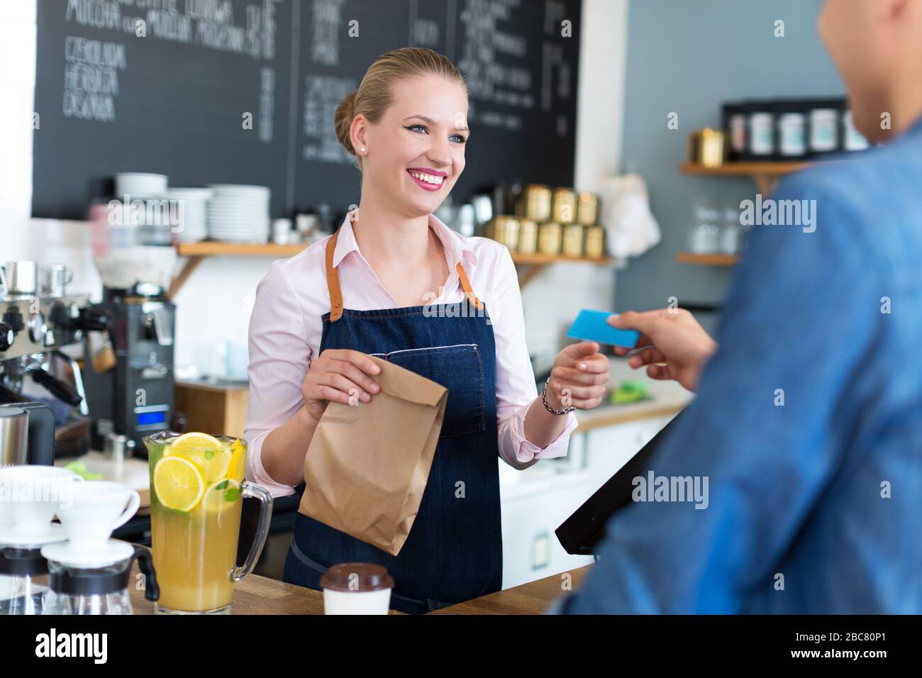 Serving customer at the coffee shop Stock Photo - Alamy