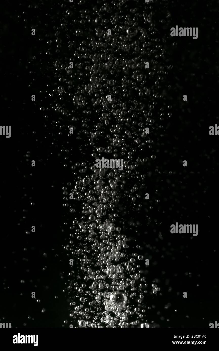 Black and white explosion of bubbles moving in water Stock Photo - Alamy