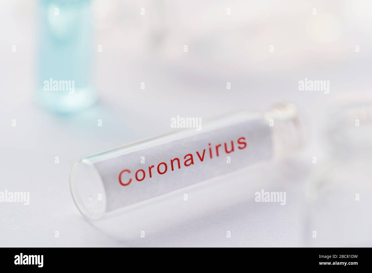 Coronavirus testing kit background. Blank test tube or glass vile over ...