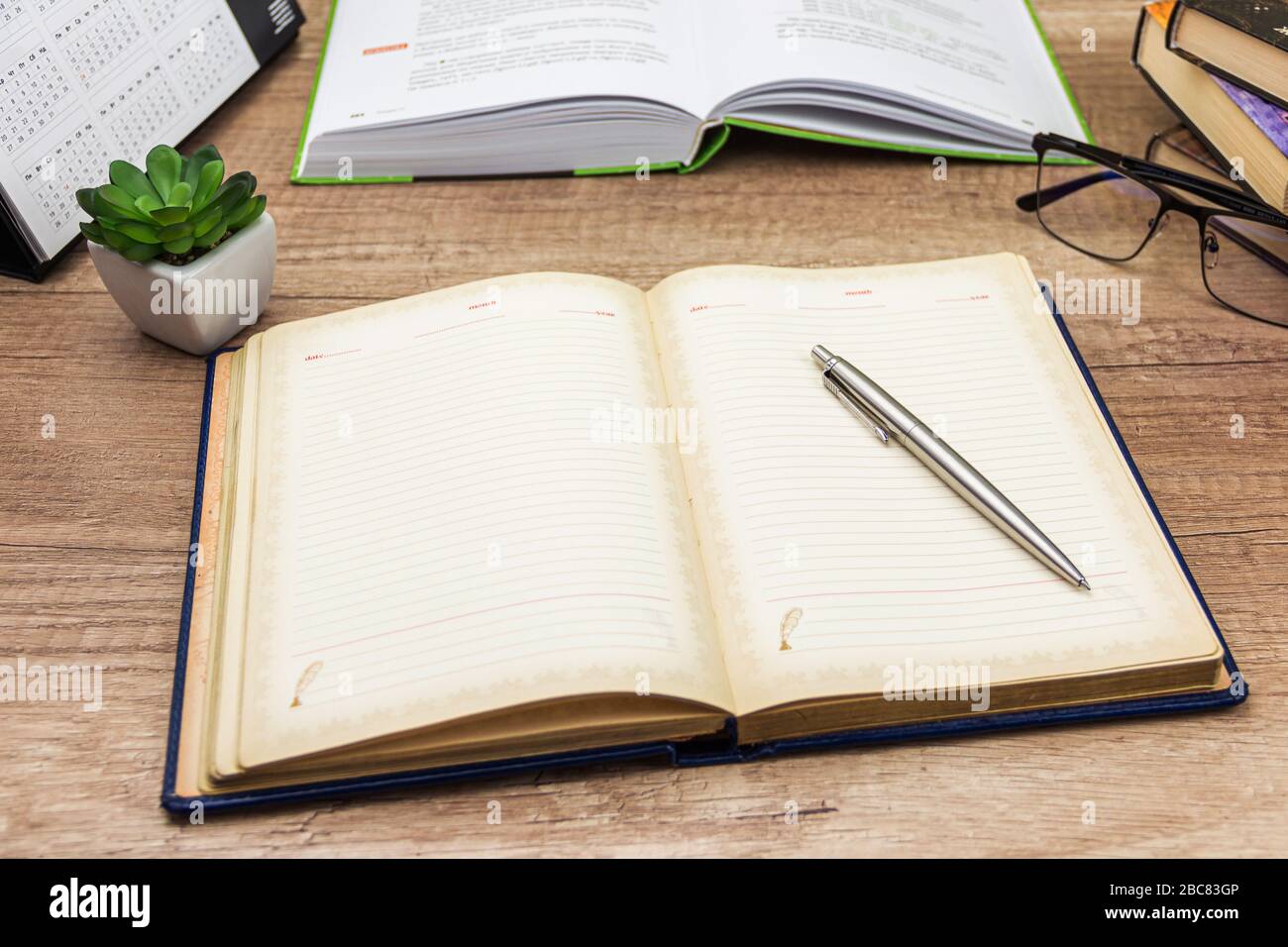 Open notebook with pen for your text on background open book, sukulent ... Open notebook with pen for your text on background open book, sukulent ...