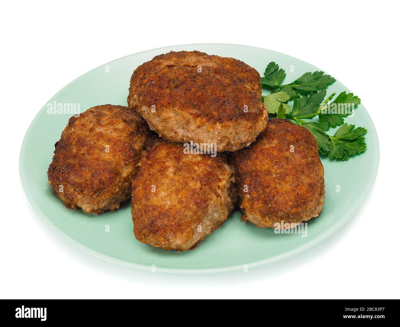 Homemade cutlets on a plate and white background Stock Photo - Alamy