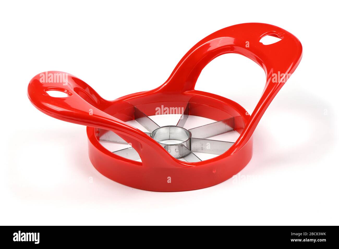 Red device for slicing apples isolated on white background. High ...