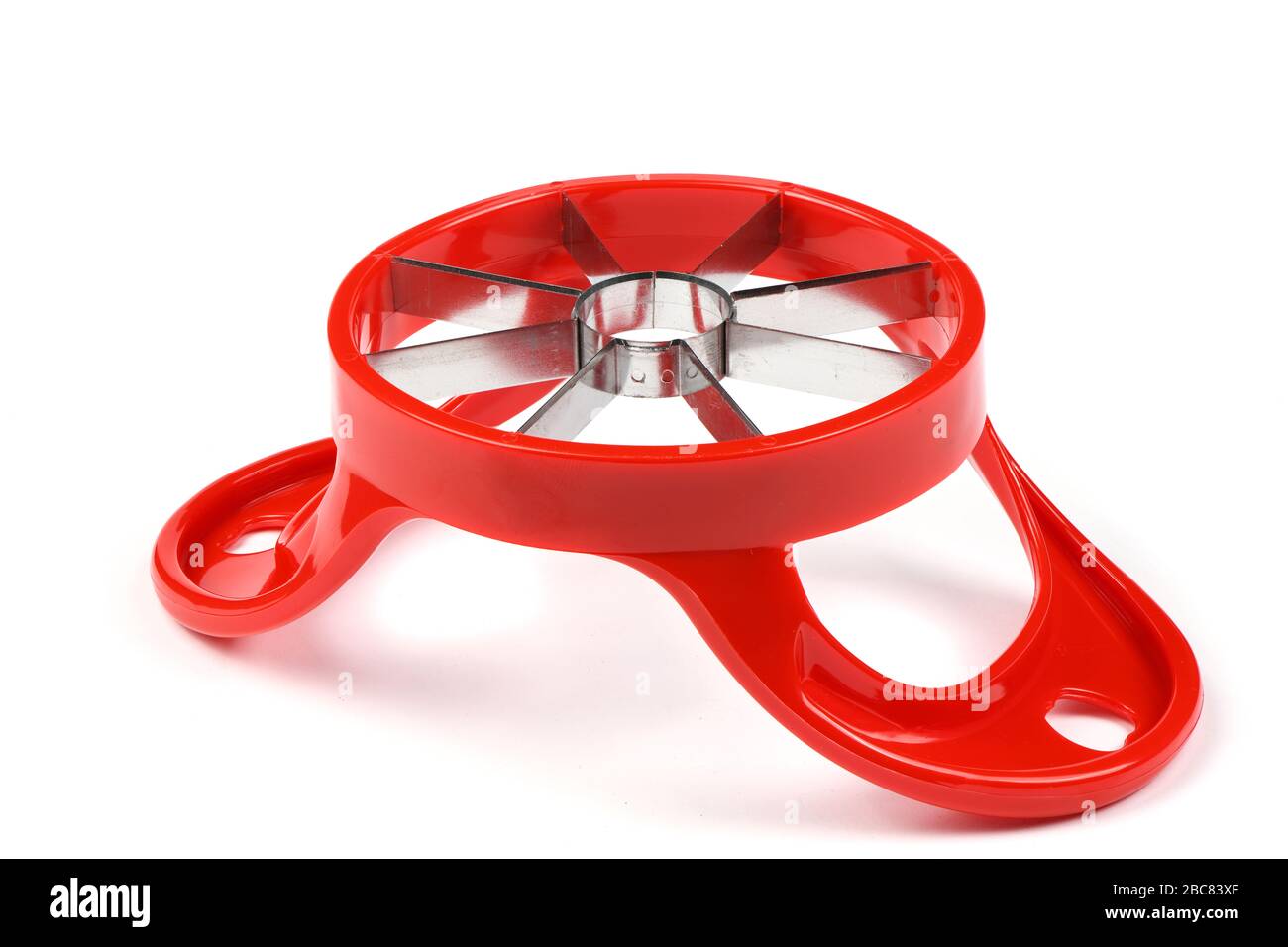 Red device for slicing apples isolated on white background. High ...