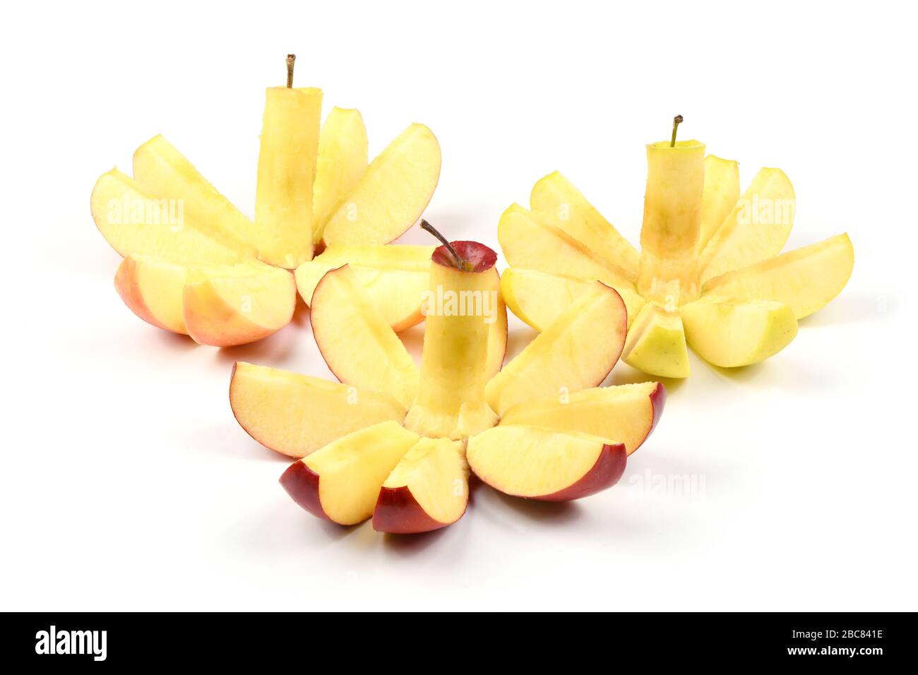 Apple slices in shape of flower isolated on white background. High ...