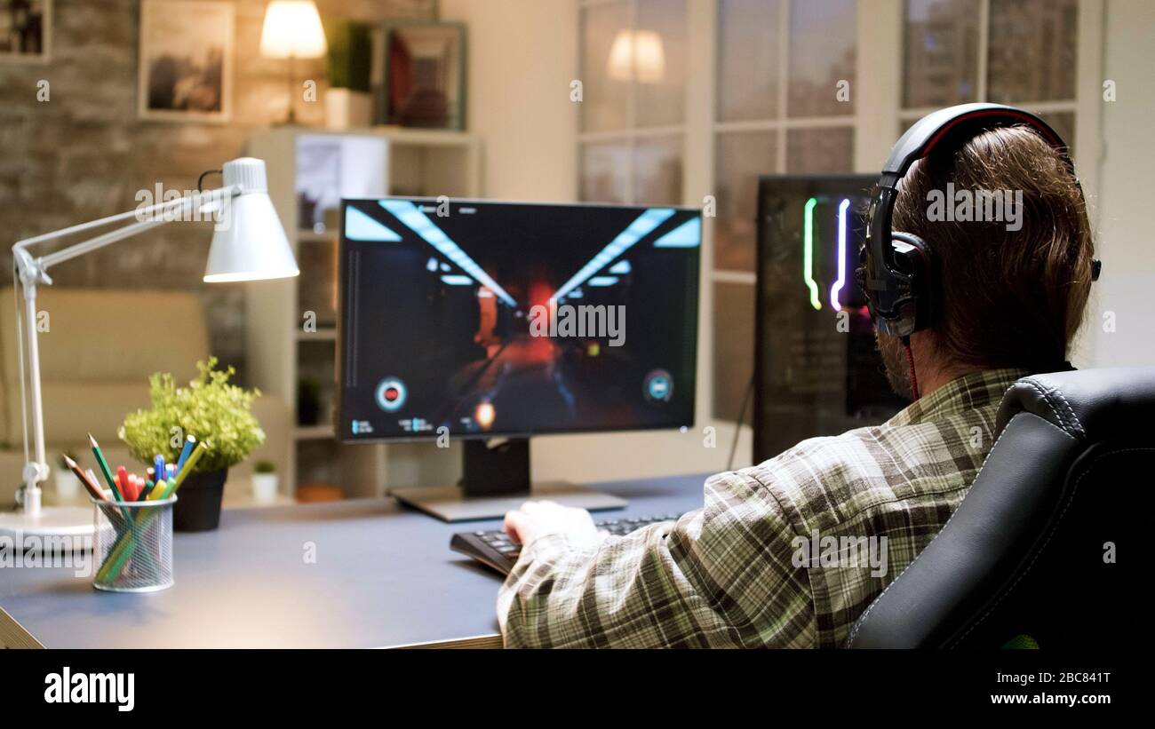 Pro bearded gamer stretching before the games starts. Man sitting on ...