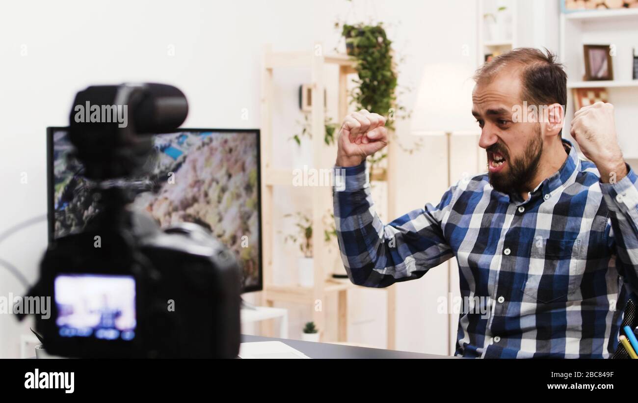 Happy reaction of famous influencer recording a vlog for subscribers ...