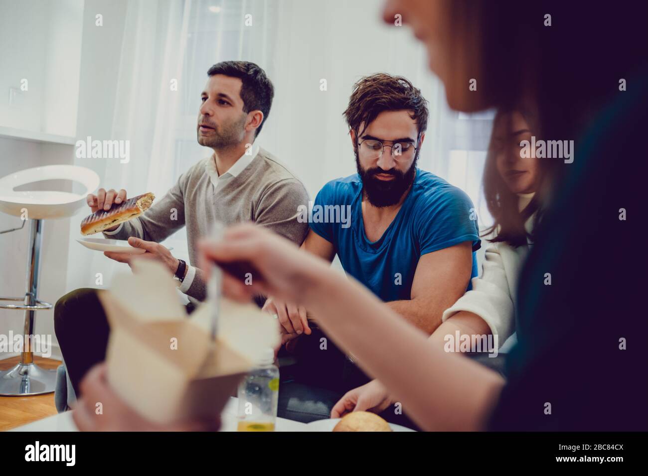 Young couple talking eating snack hi-res stock photography and images ...
