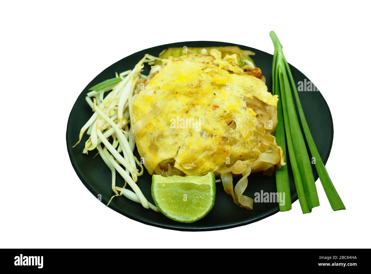 Pad Thai stir fried rice noodles with dry shrimp wrapped with egg on ...