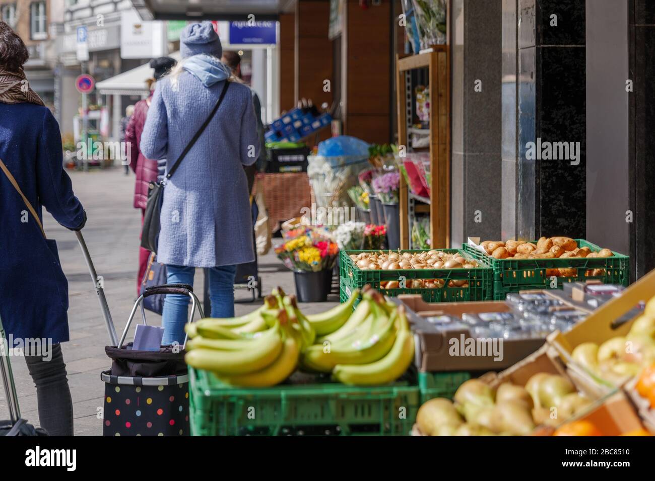 Selected focus, European people queue outside in front of food stall ...
