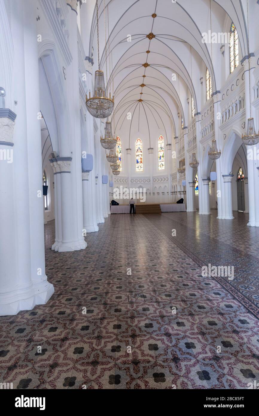 The interior of CHIJMES Hall, showing the arched ceiling and stained ...