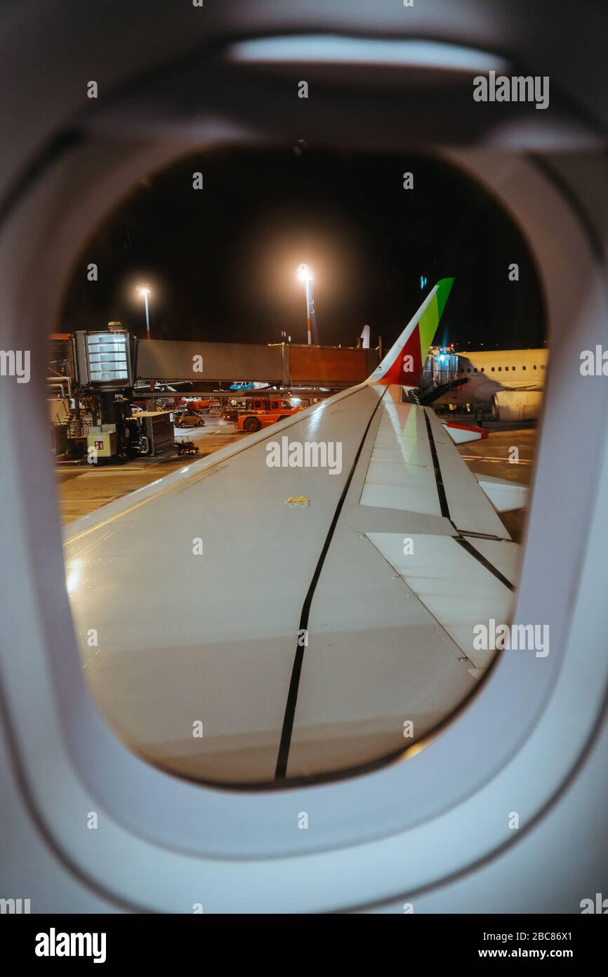 Airplane departing at evening time. Airdrome and another aircrafts are ...