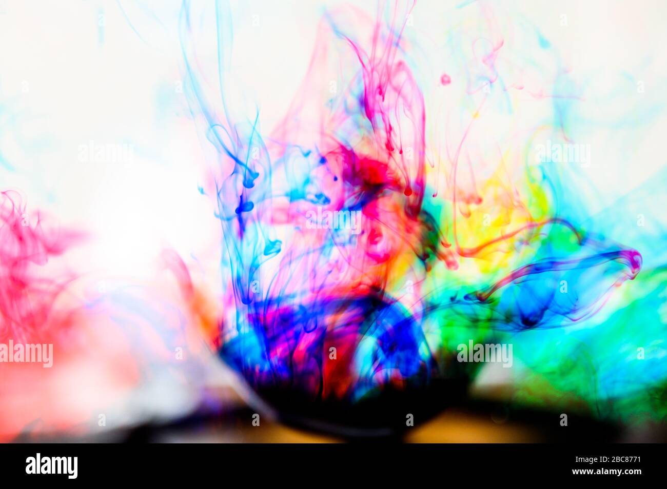 Ink splash in water multiple colour effect white background Stock Photo ...