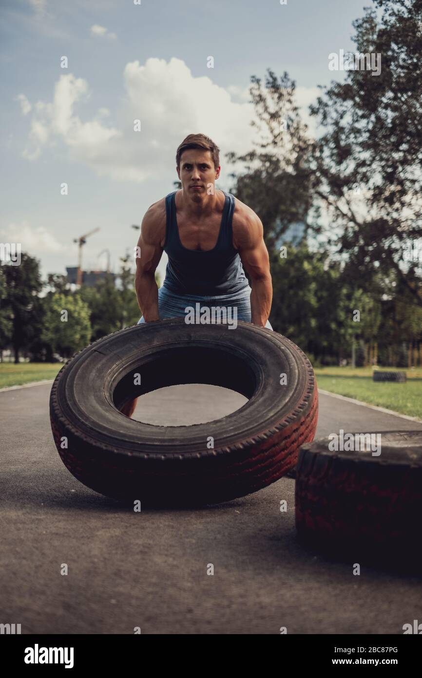 Man flipping tire hi-res stock photography and images - Alamy