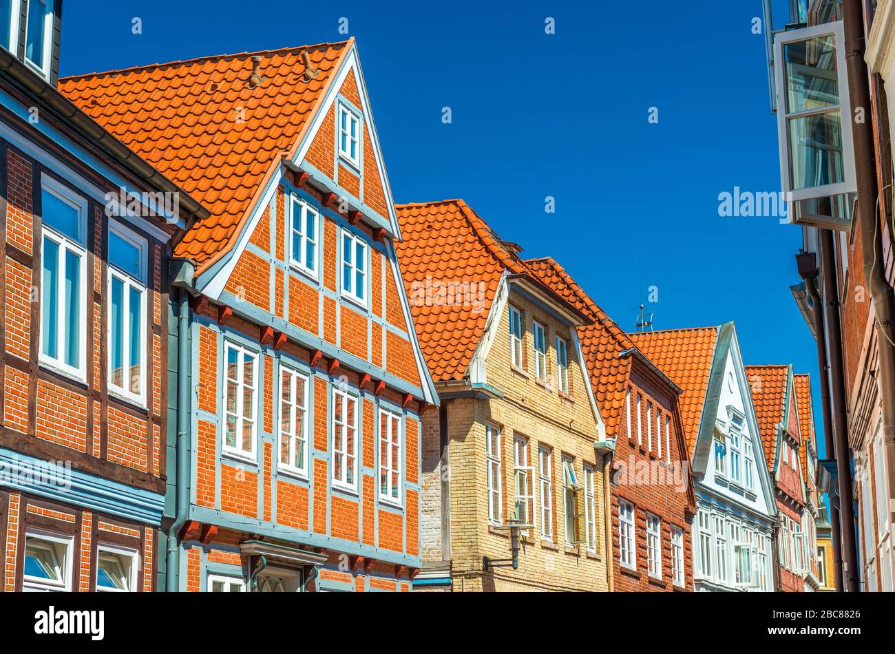 A street with traditional German architecture, half-timbered houses ...