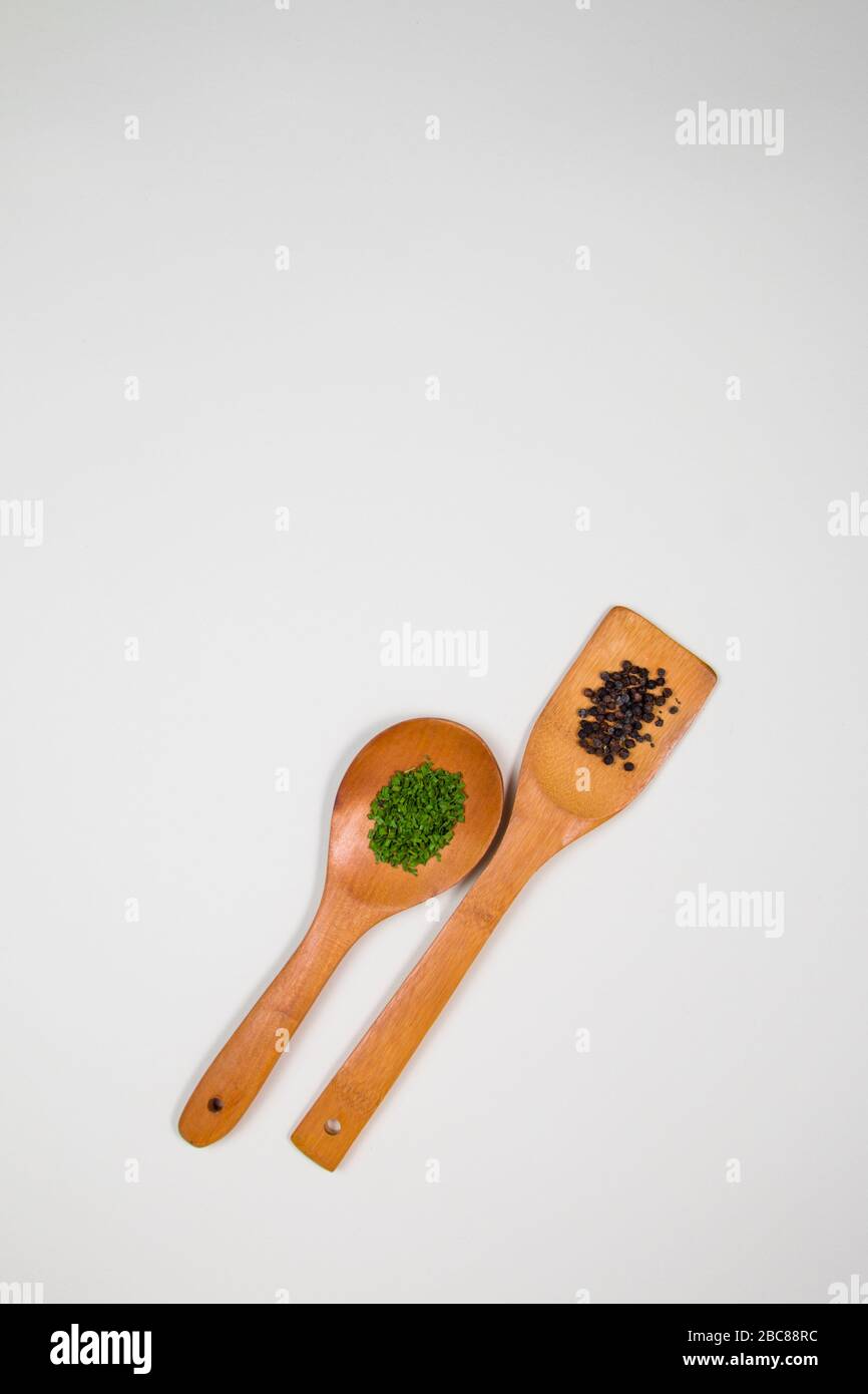 Wooden ladle with green herbs and spices Stock Photo - Alamy