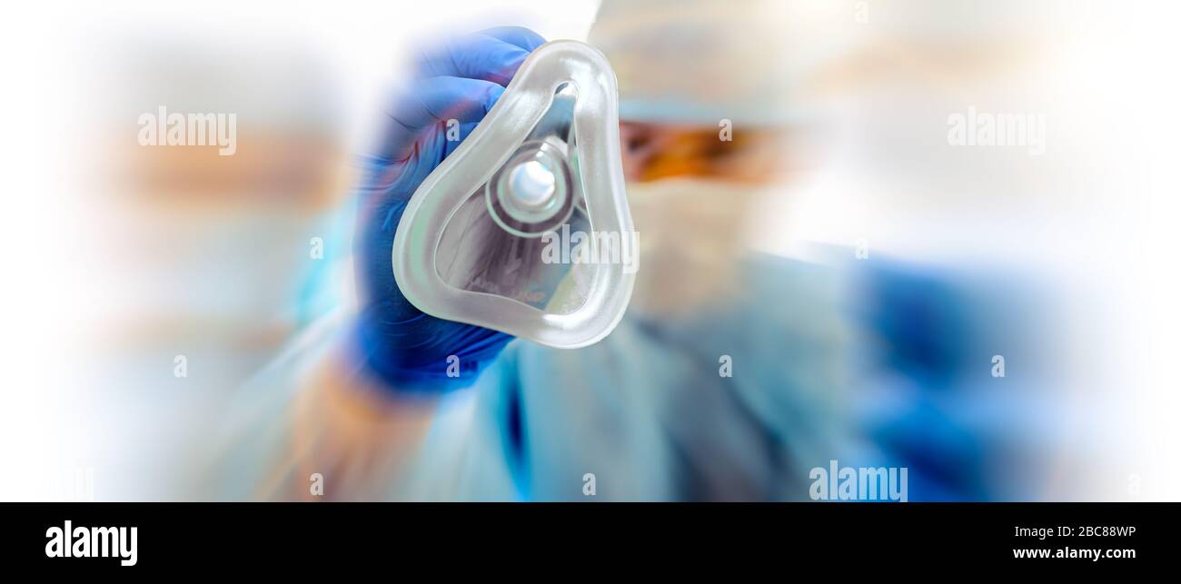 Medic puts on oxygen mask. Connecting to an artificial respiration ...