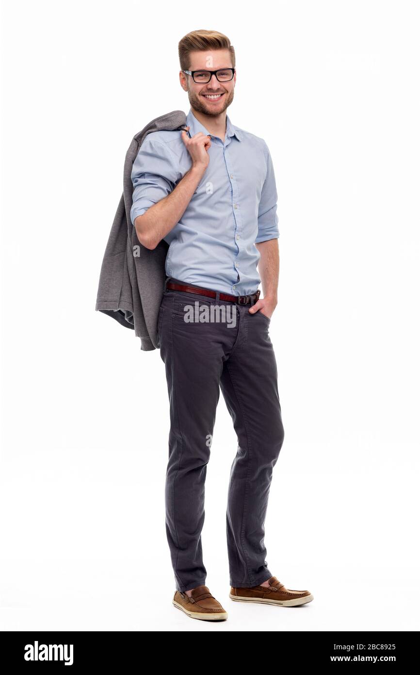 Portrait of young man standing on white background Stock Photo - Alamy