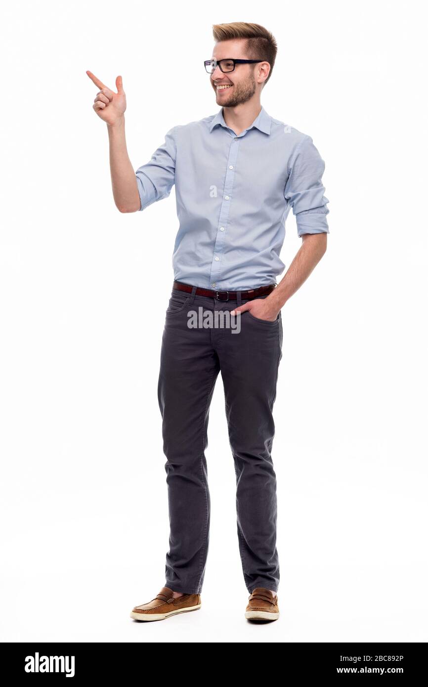 Portrait of young man standing on white background Stock Photo - Alamy