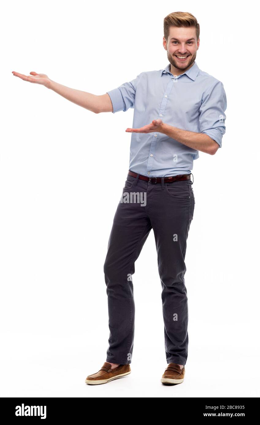 Portrait of young man standing on white background Stock Photo - Alamy