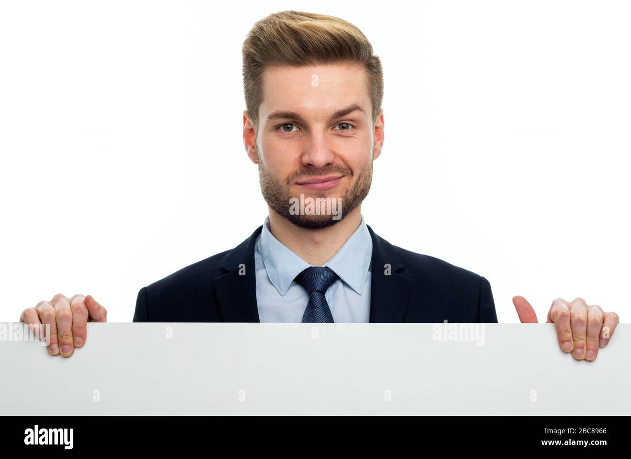 Business man holding white board Stock Photo - Alamy