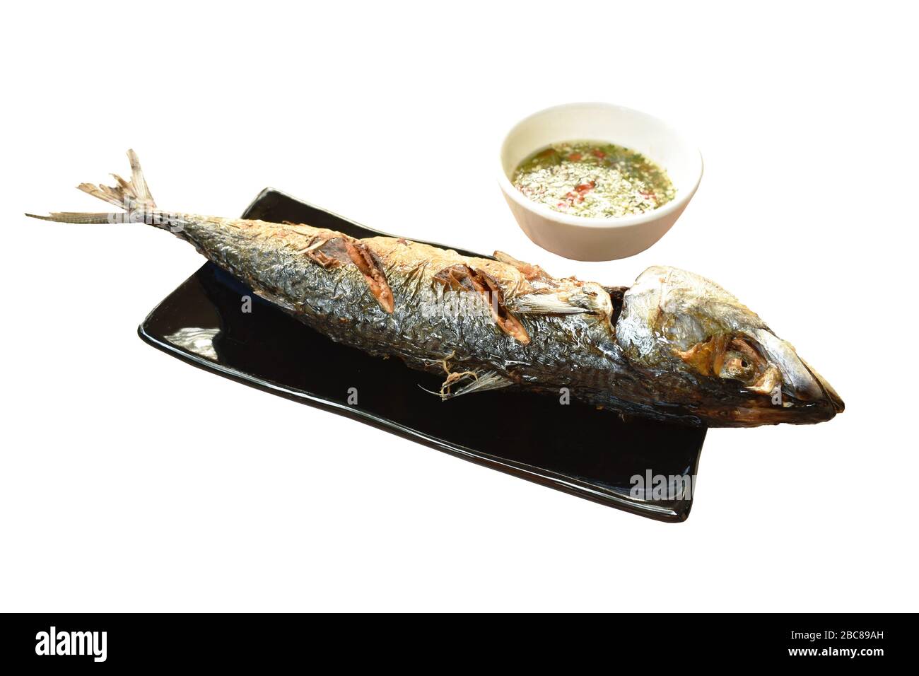 deep fried saba fish or mackerel on plate dipping spicy sauce Stock ...