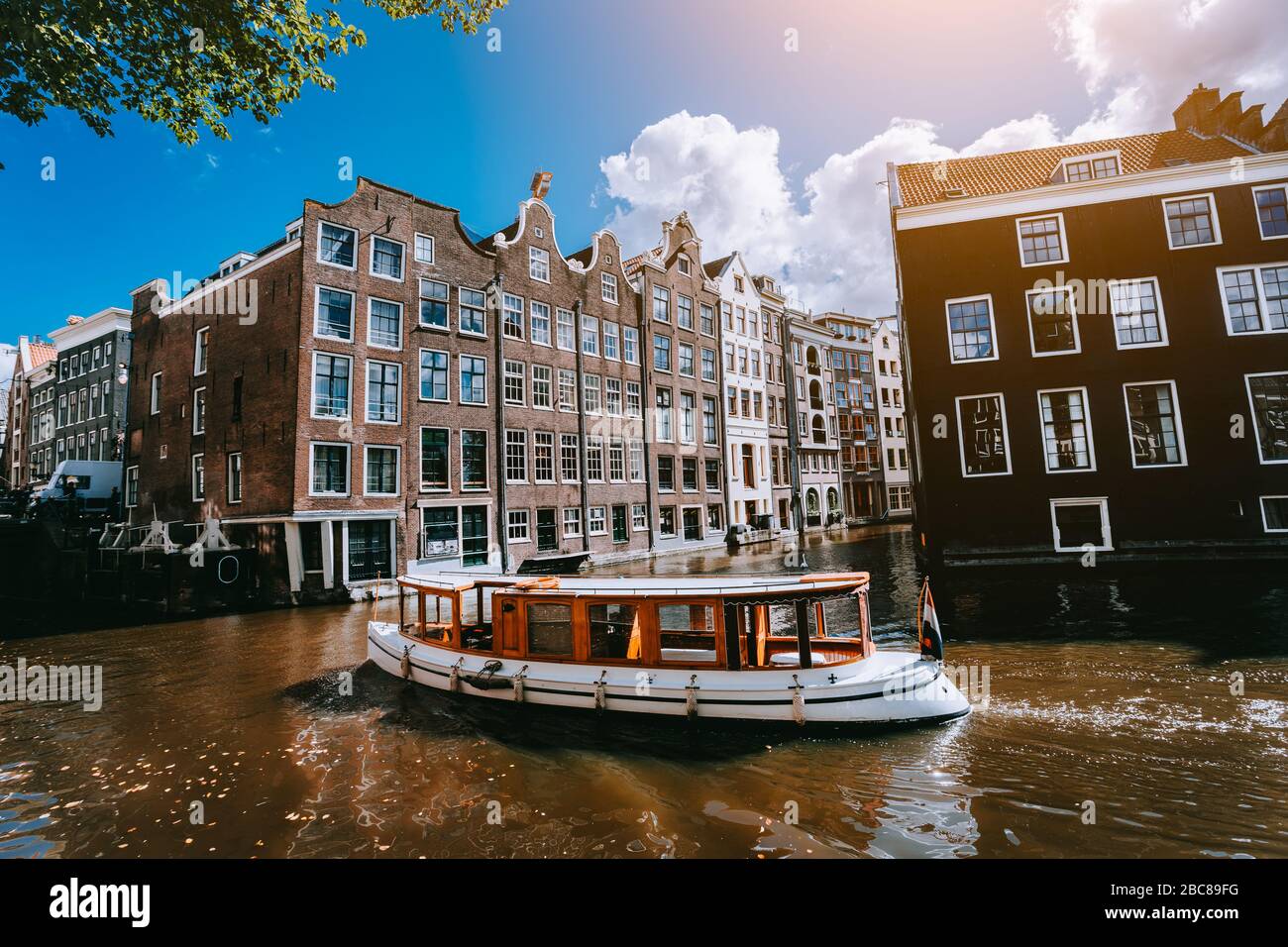 City of Amsterdam in Holland picturesque scenery, white boats on a ...