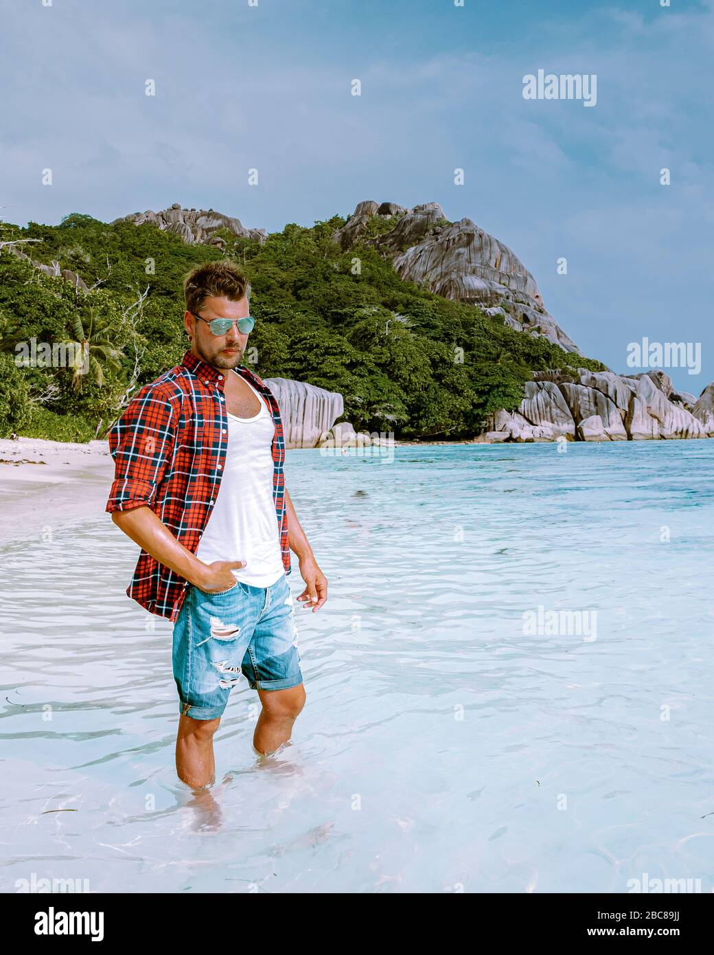 La Digue Seychelles, young men on vacation at the tropical Island La ...
