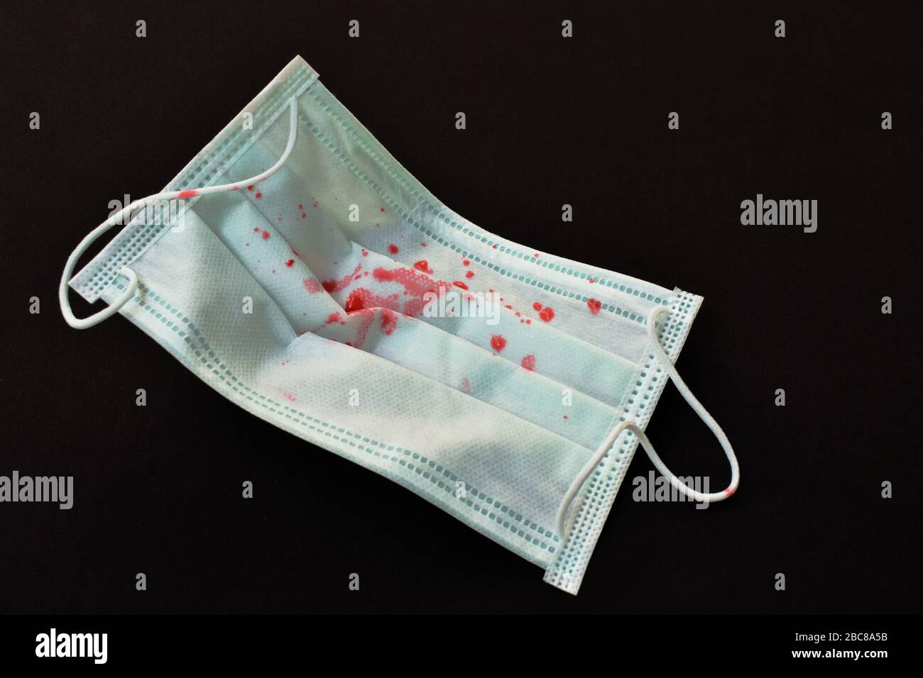 blood from cough patient on hygienic mask for protection nose and mouth ...