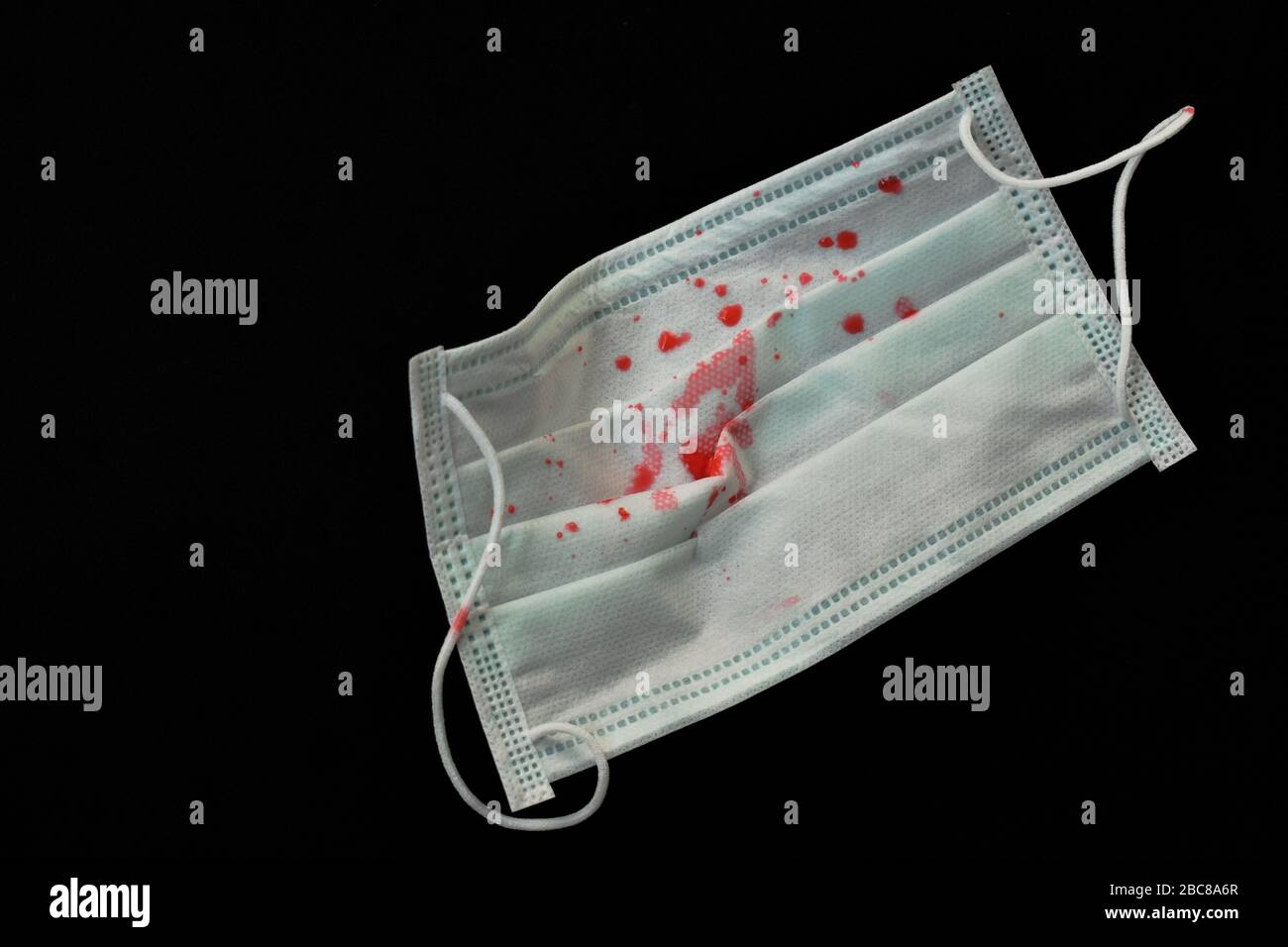 blood from cough patient on hygienic mask for protection nose and mouth ...