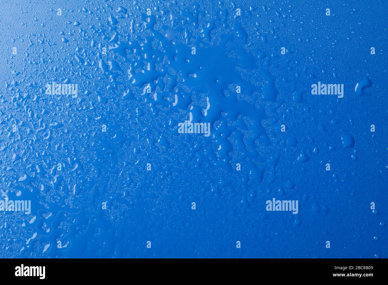 Blue background with water, top view. Wet background Stock Photo - Alamy