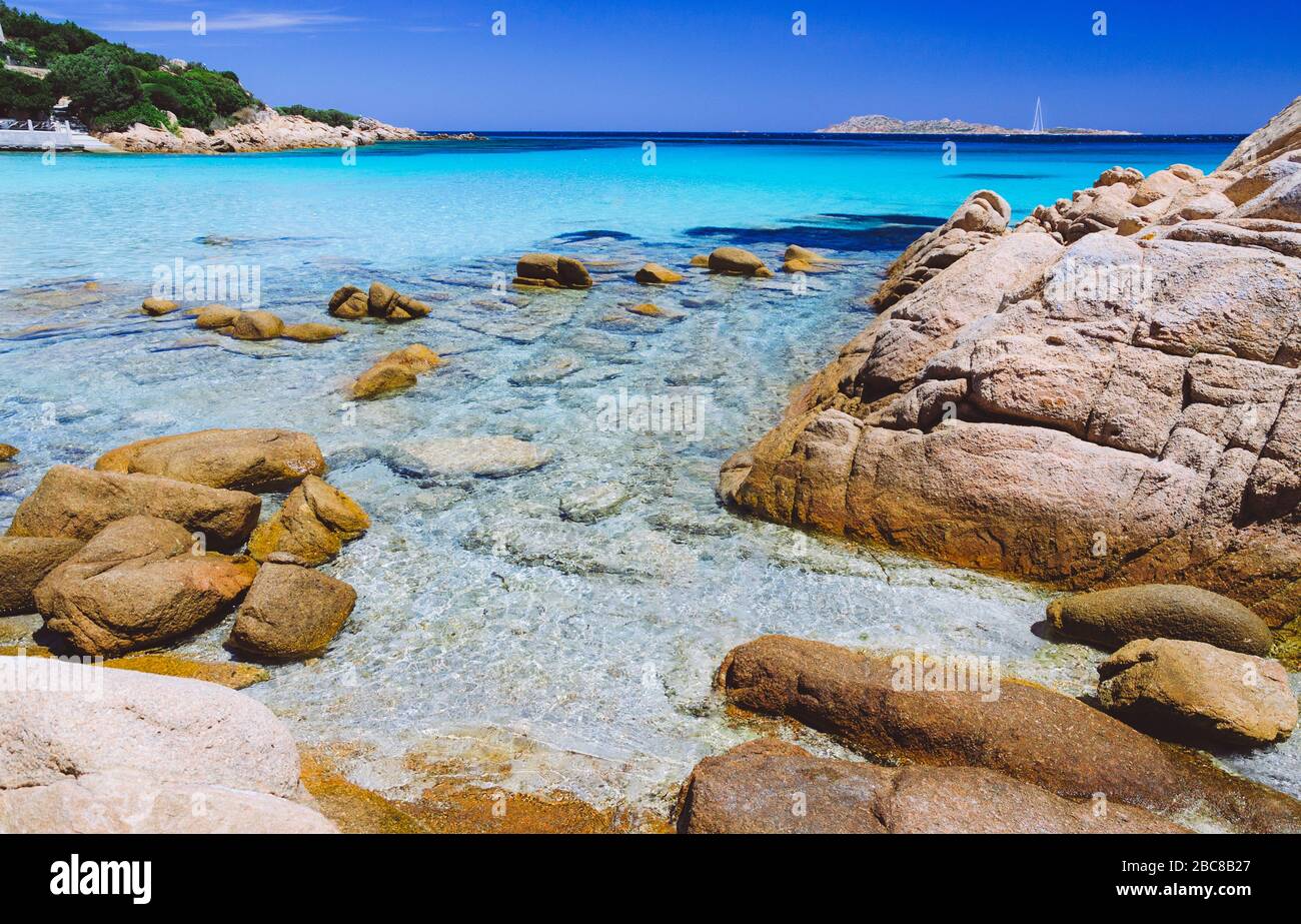 Clear amazing azure and turquoise colored sea water with huge granite ...