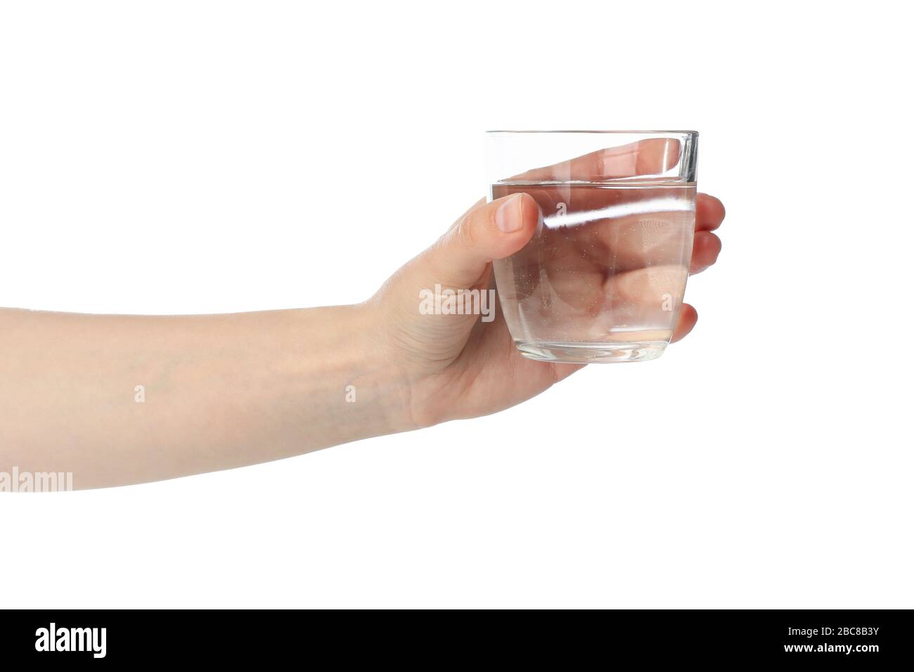 Female hand holds glass of water, isolated on white background Stock ...