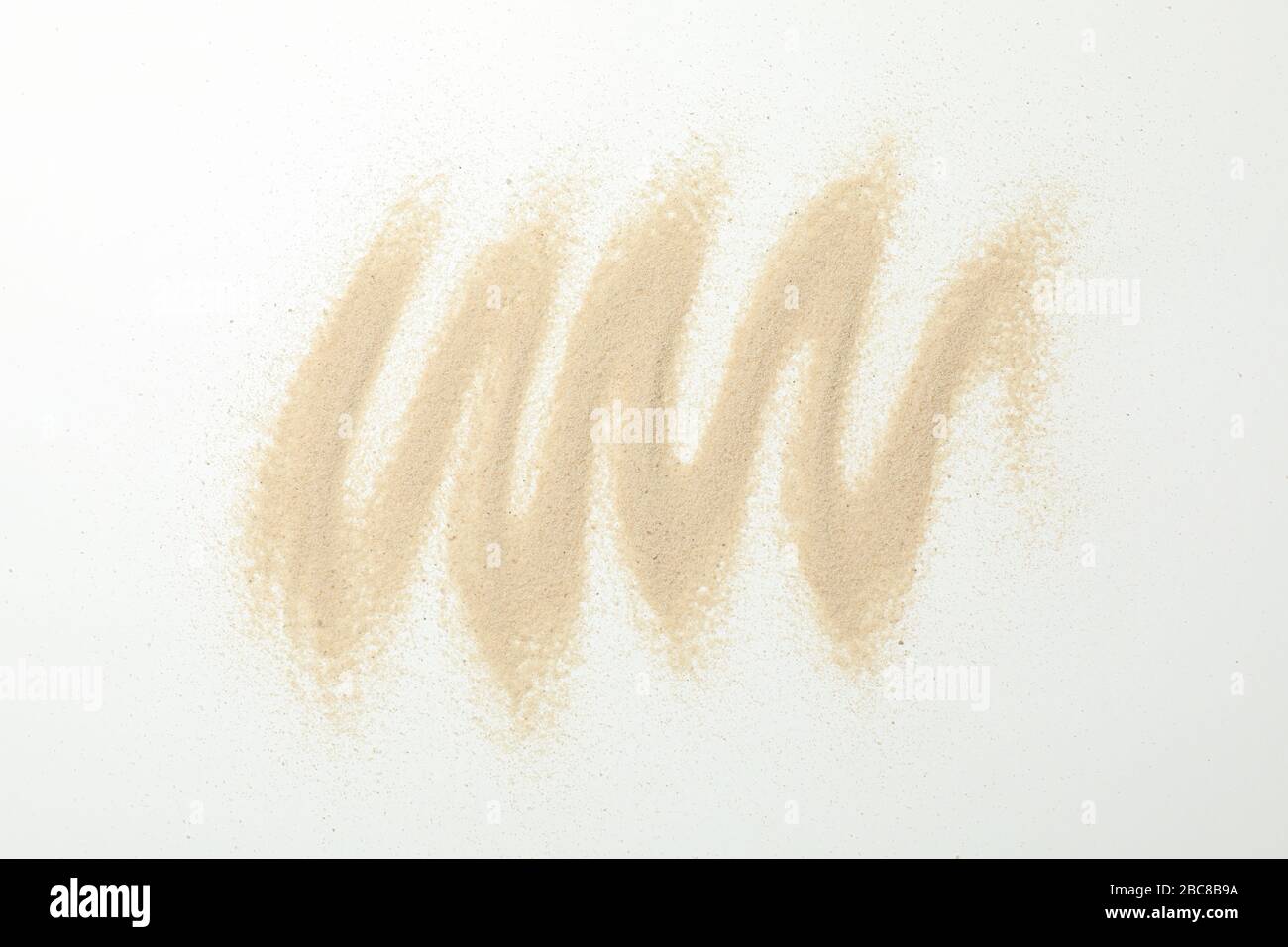 Dry sea sand on white background, top view Stock Photo - Alamy