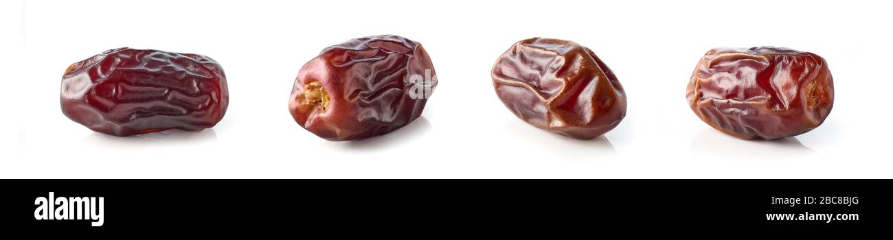 Whole dates isolated on white background Stock Photo - Alamy