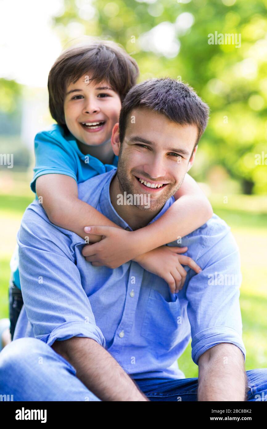 Father and child playing outdoors Stock Photo - Alamy