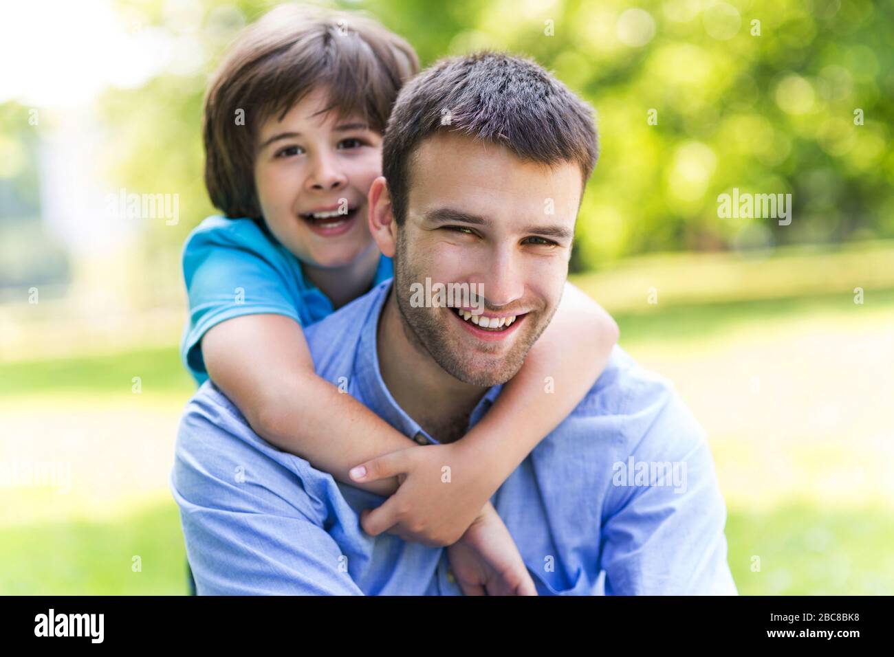 Father and child playing outdoors Stock Photo - Alamy