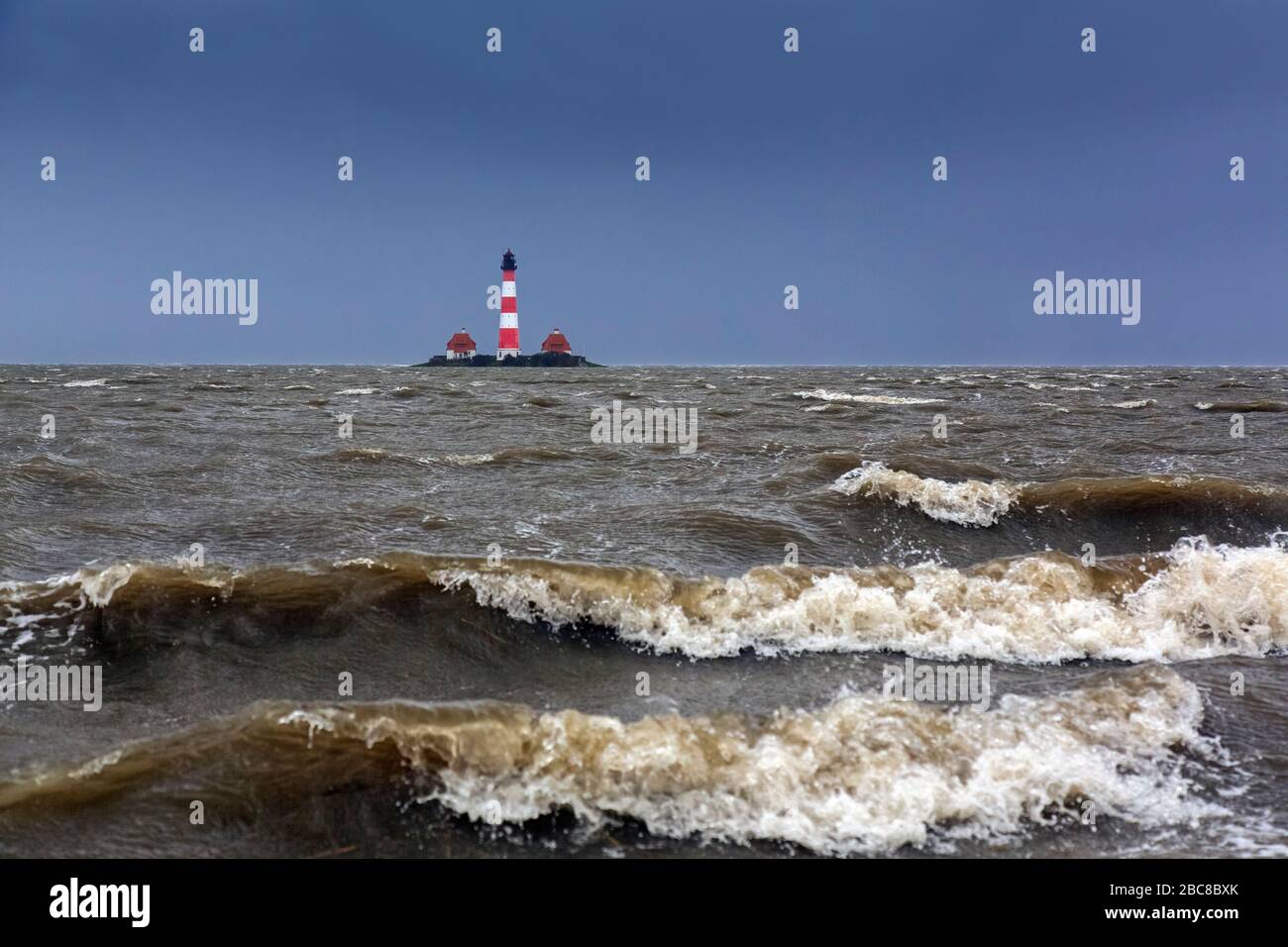 Lighthouse Westerheversand at Westerhever during high water spring tide ...
