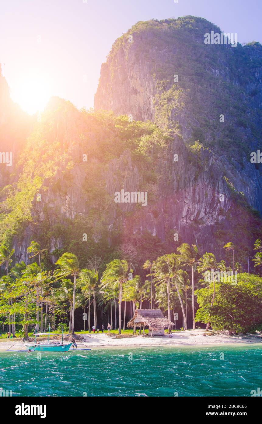 Ipil beach in evening sunlight on Inabuyatan Island, El Nido, Palawan ...
