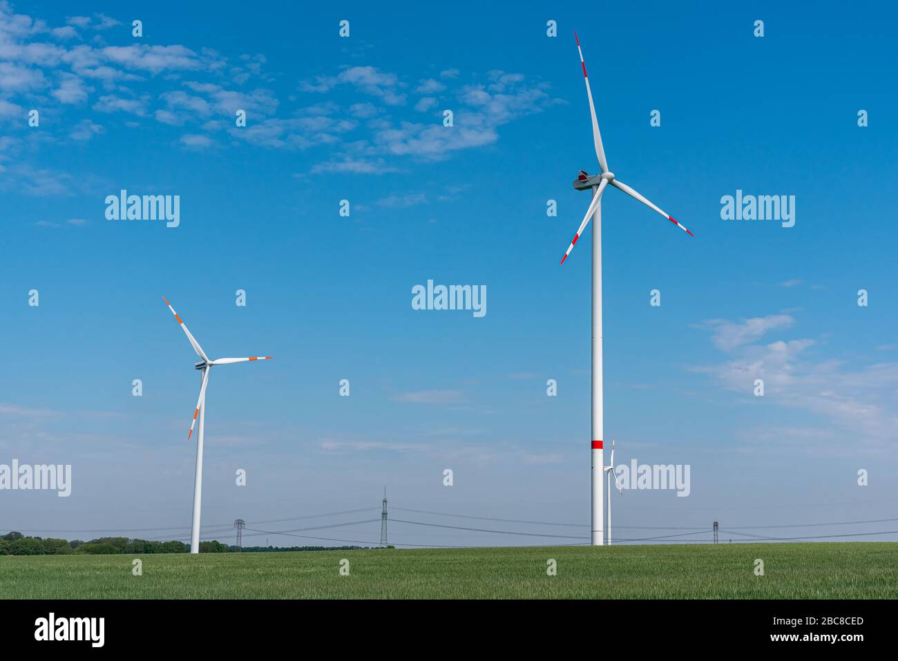 Modern wind energy turbines in a cornfield seen in Germany Stock Photo ...