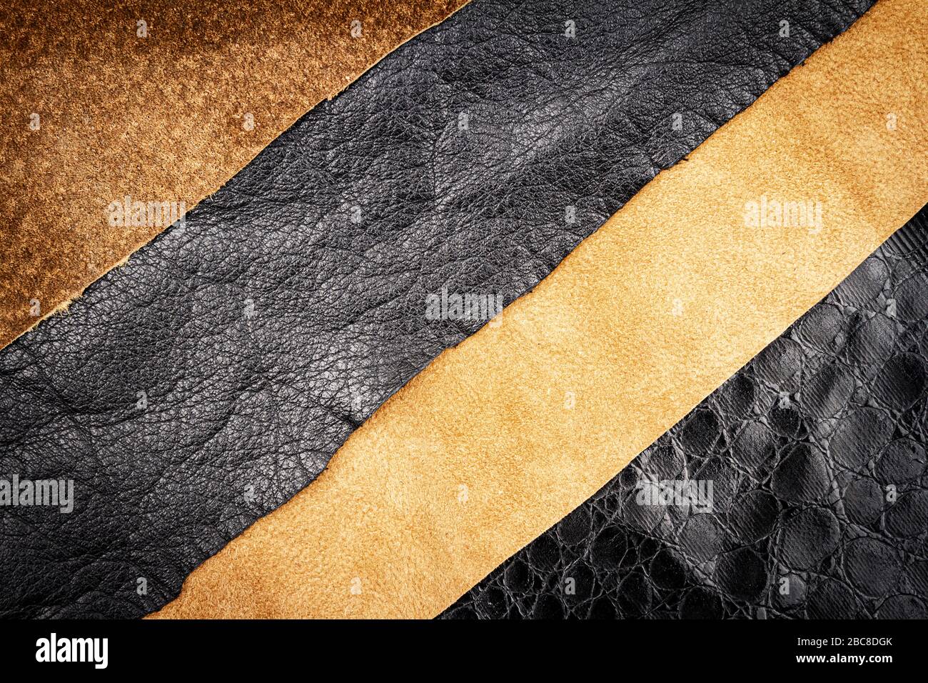 Brown and black leather and artificial alligator skin textures ...