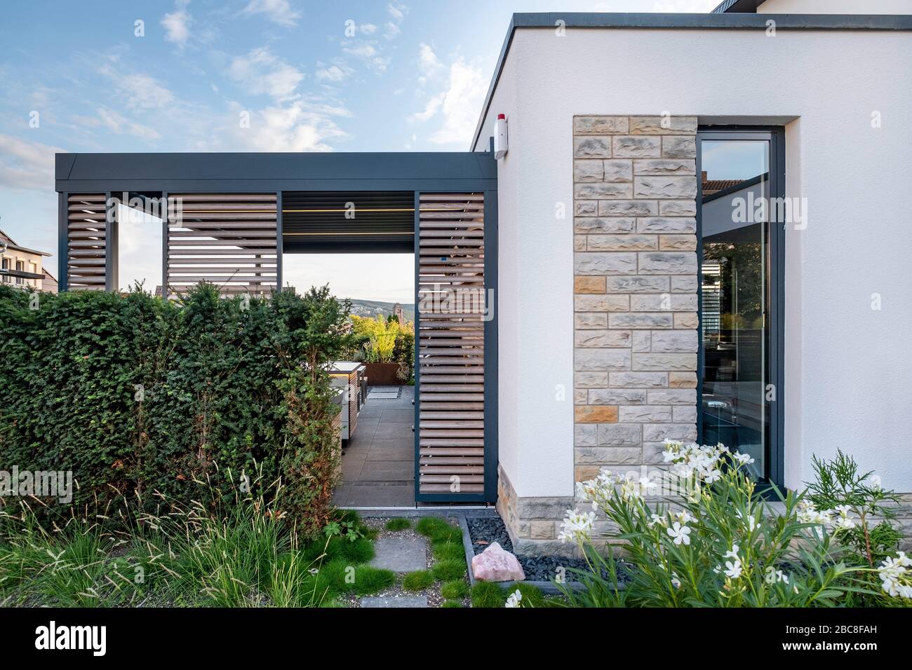Covered terrace surrounded by privacy screens Stock Photo - Alamy