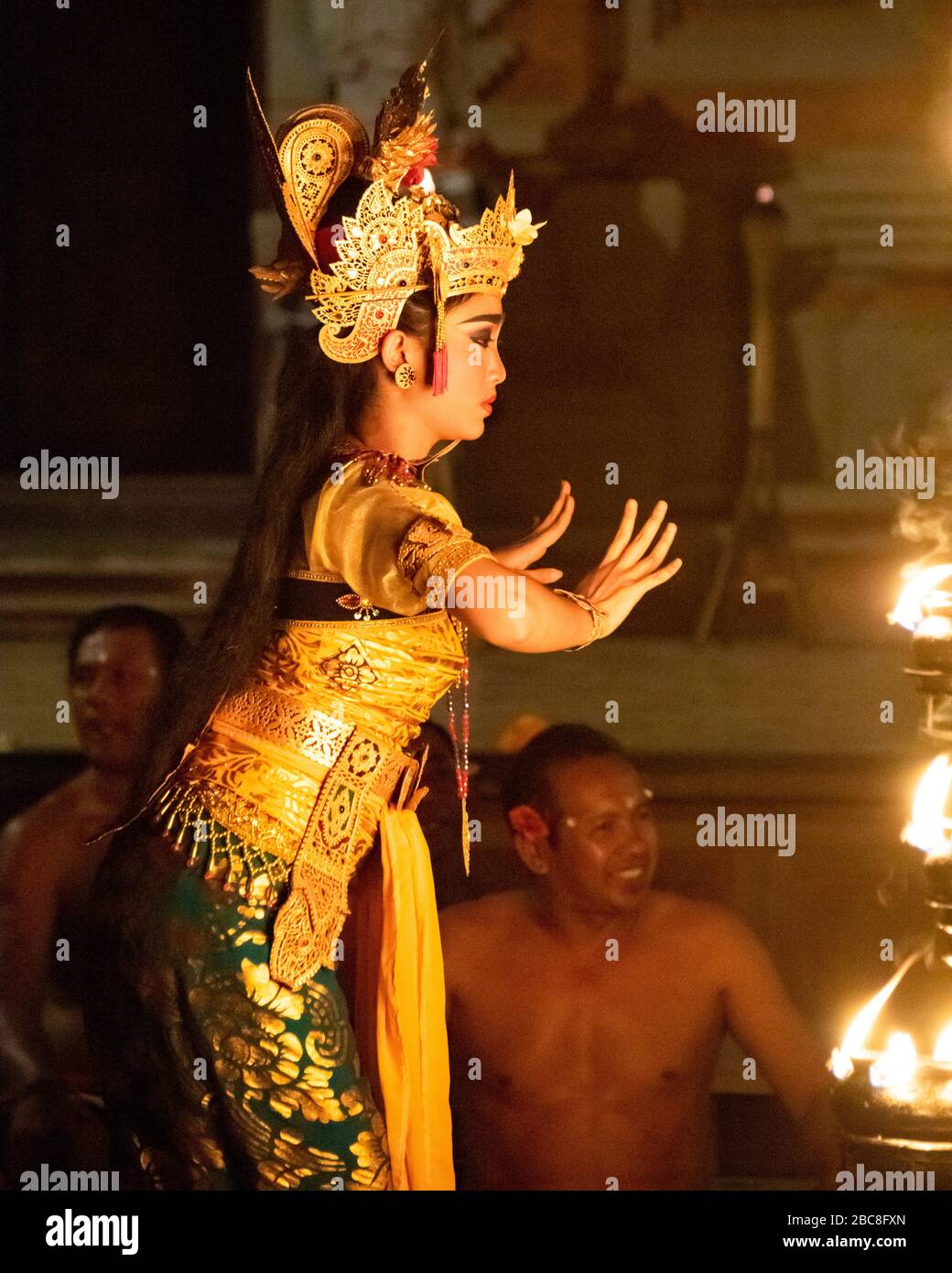 Vertical portrait of a female character in Kecak Fire Dance in Bali ...