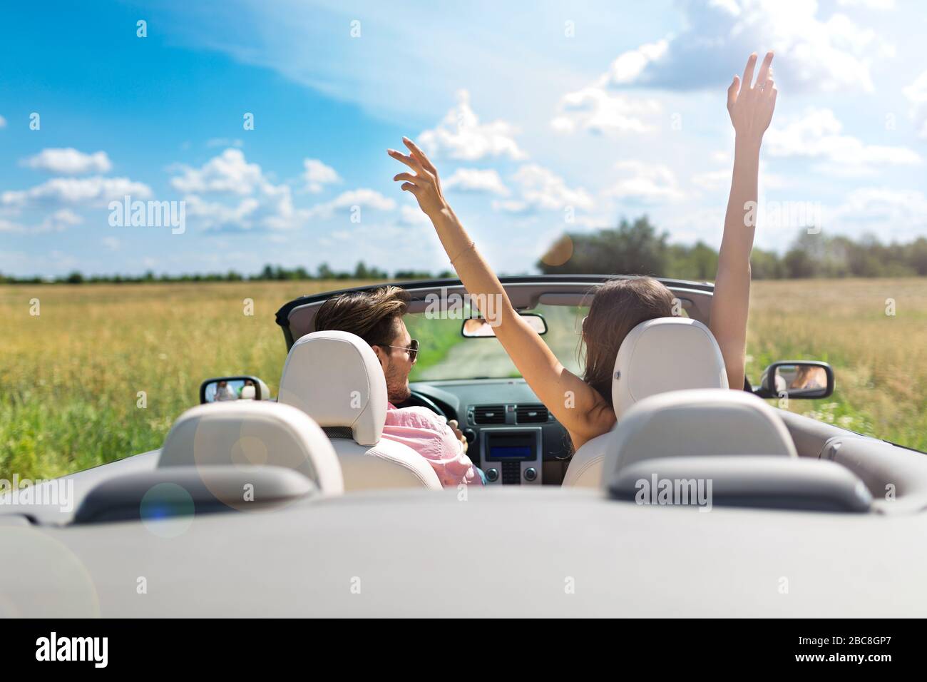 Young couple driving in cabriolet hi-res stock photography and images ...