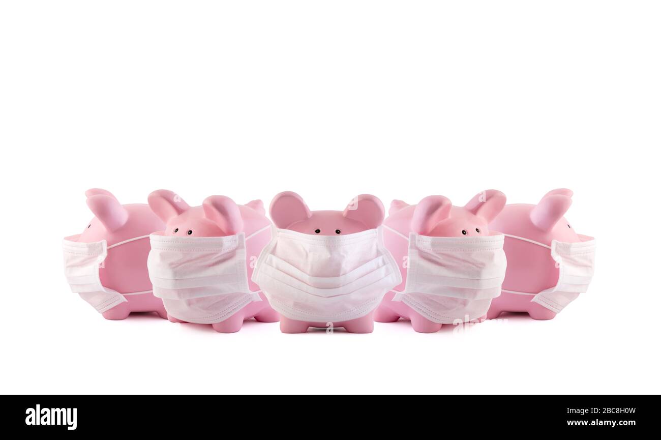 Group of pink piggy banks with protective medical masks on white ...
