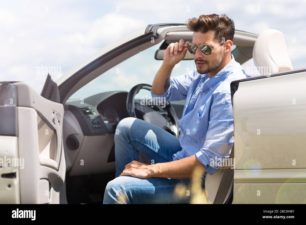 Cool guy driving convertible car hi-res stock photography and images ...