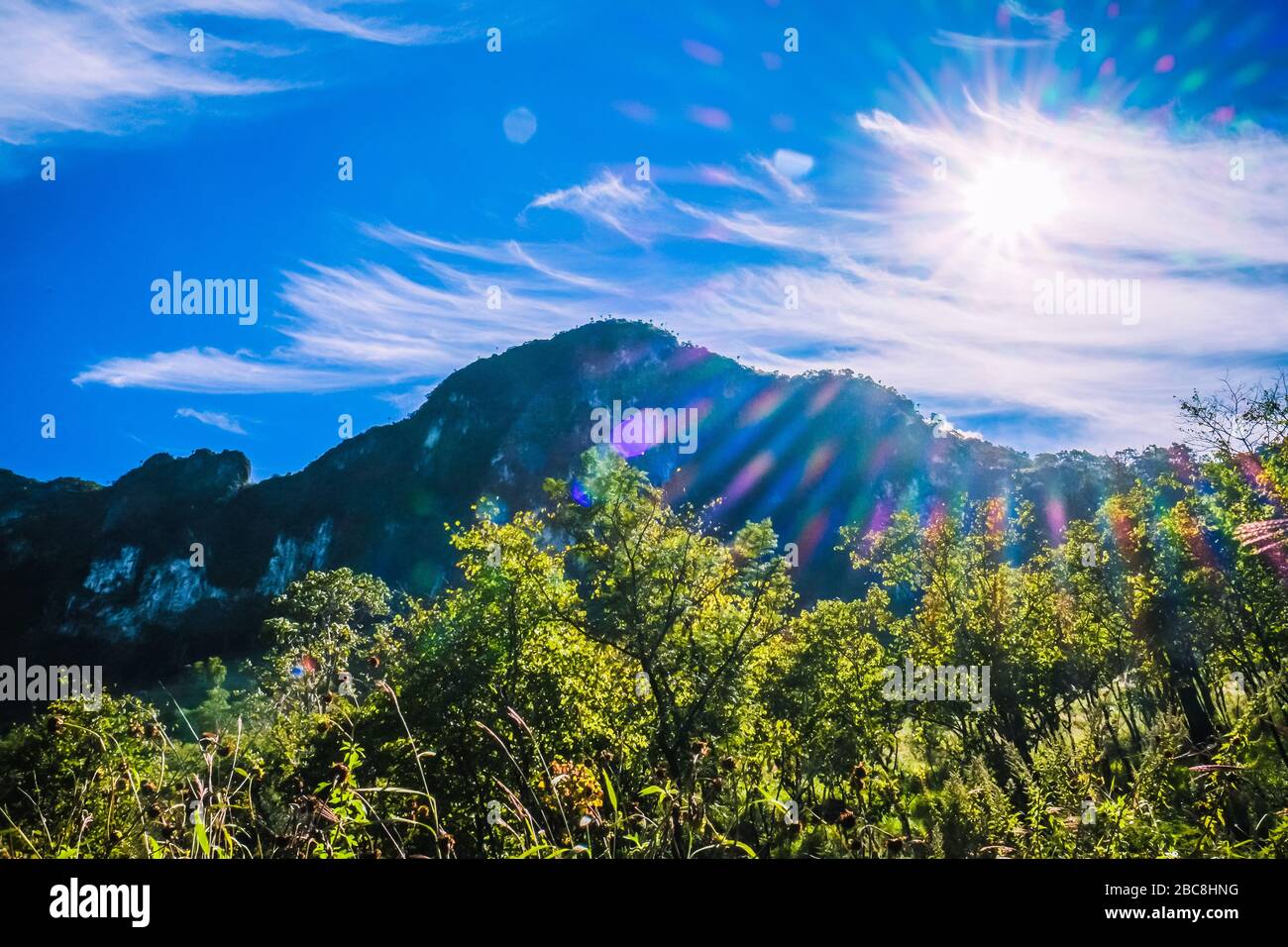 big mountain with clear blue sky and backlit Stock Photo - Alamy