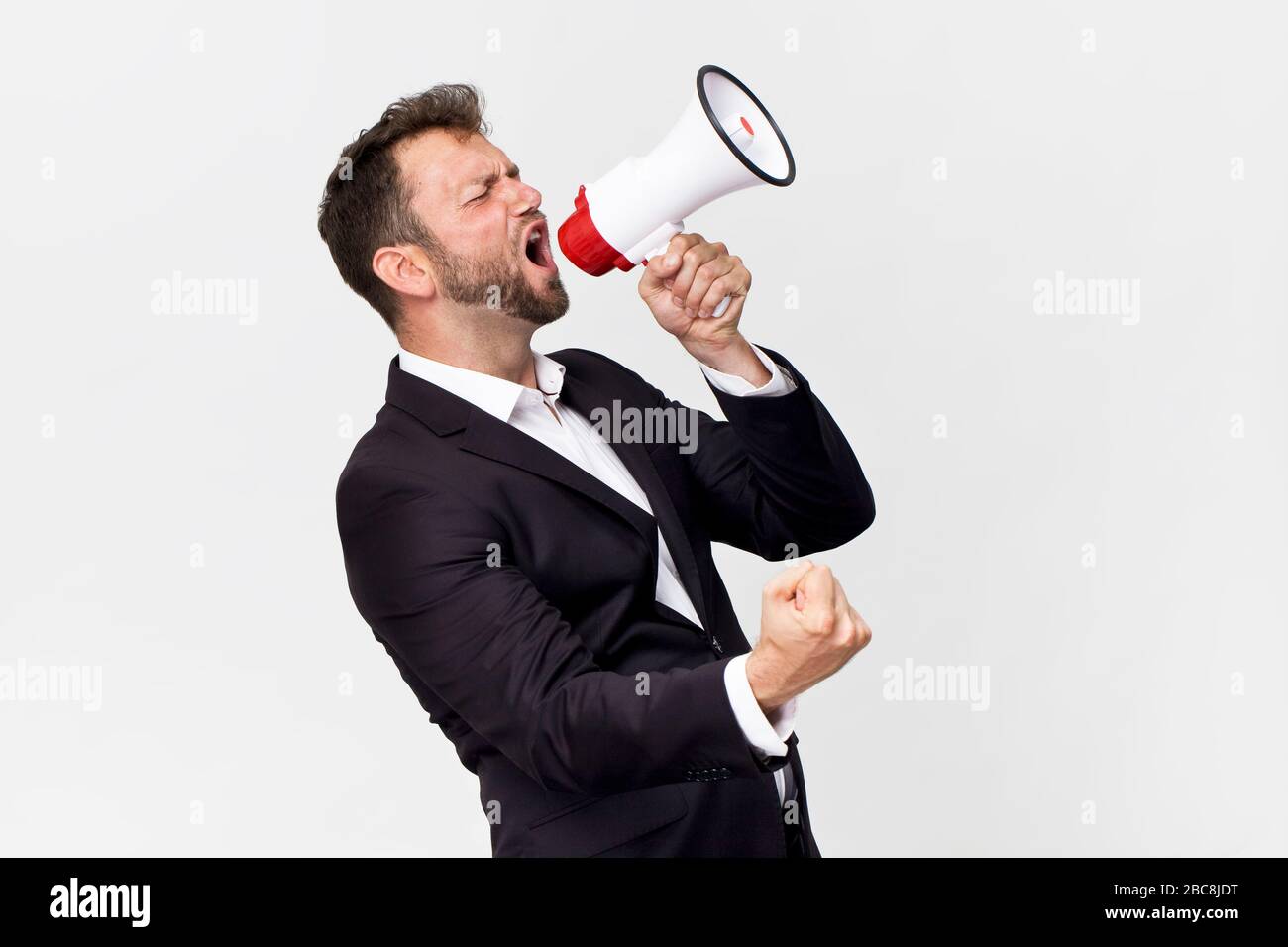 Portrait man yelling megaphone hi-res stock photography and images - Alamy