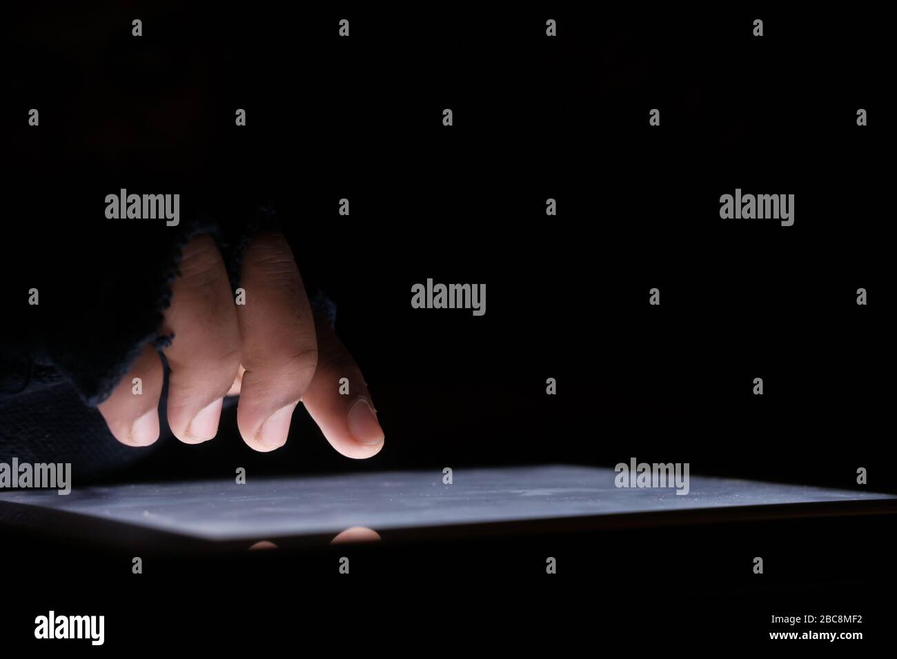 Close up of hacker hand stealing data Stock Photo - Alamy