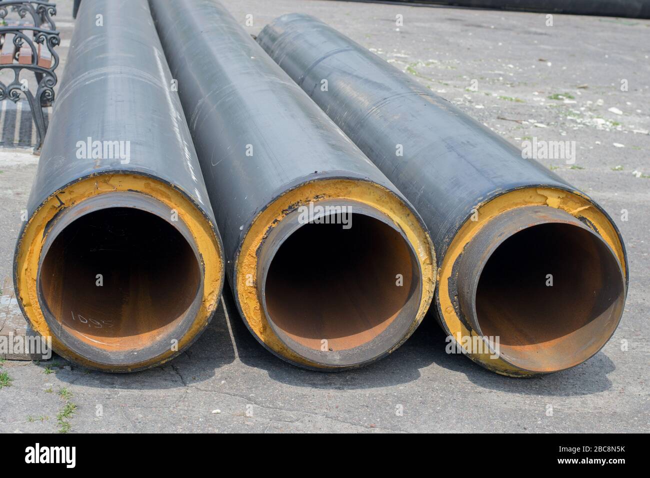 Laying of large-diameter pipes to replace the heating main Stock Photo ...