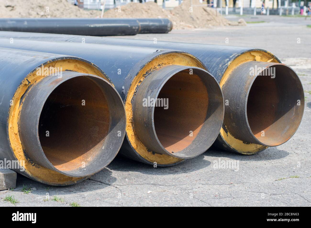 Laying of large-diameter pipes to replace the heating main Stock Photo ...